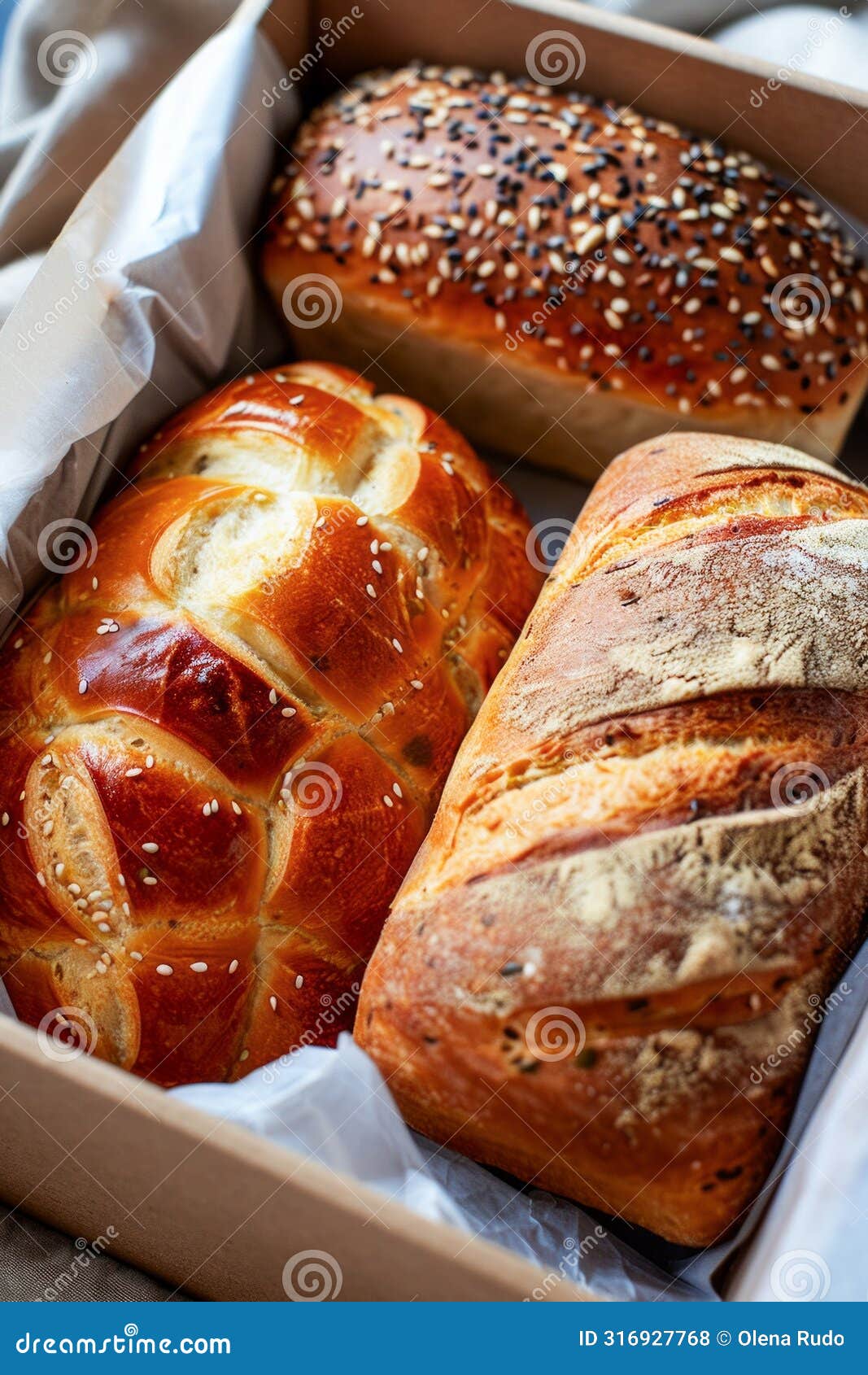 Assorted Freshly Baked Bread in a Cardboard Box, Displaying Various ...