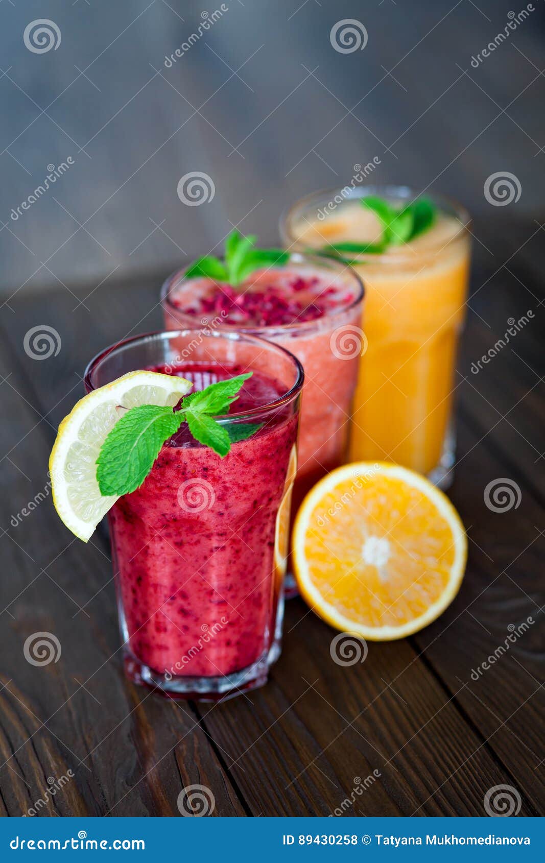 Assorted Fruit Smoothies on a Wooden Table Stock Photo - Image of ...