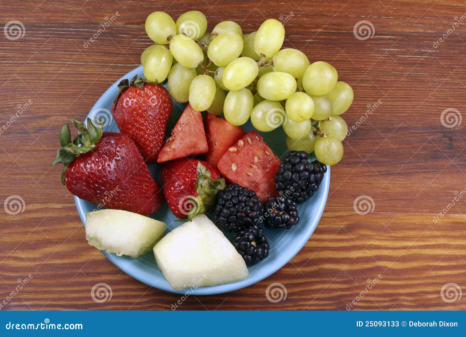 Assorted Fruits on a plate stock image. Image of melon - 25093133