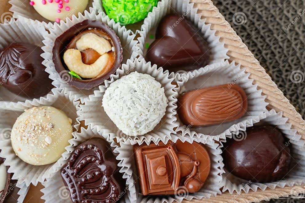 Assorted Handmade Chocolates. Candy in a Triangular Box Stock Photo ...