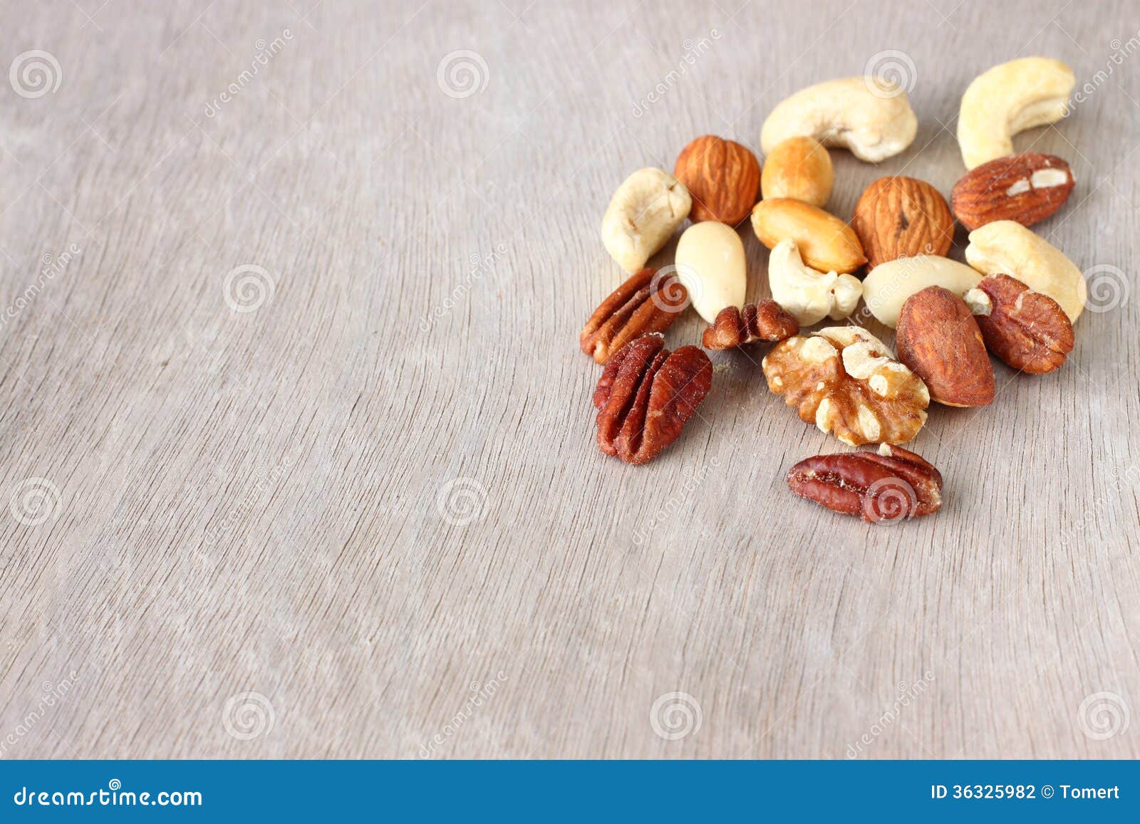 Assorted Healthy Mixed Nuts on Wooden Textured Background Stock Photo ...