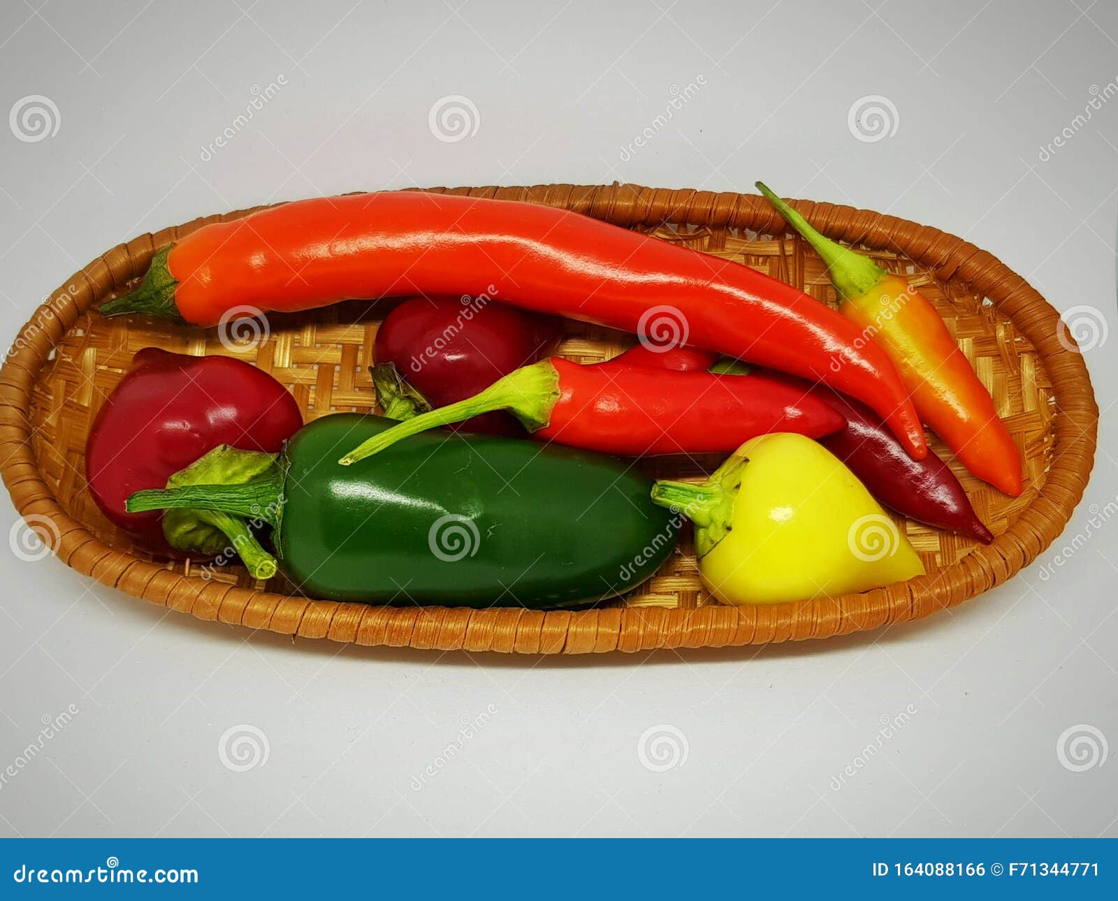 Assorted Hot Peppers on a Wicker Plate Stock Photo - Image of food ...