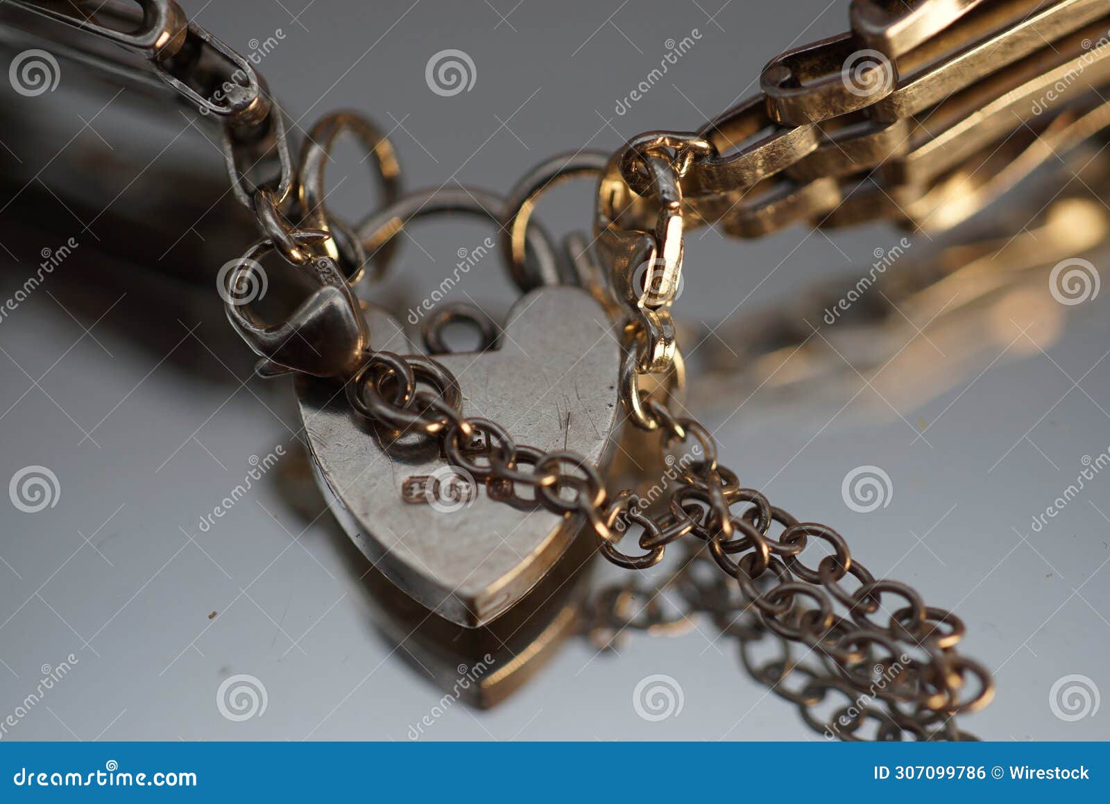 An Assortment of Keys and a Heart Shaped Lock with a Chain Stock Photo ...