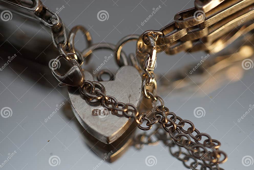 An Assortment of Keys and a Heart Shaped Lock with a Chain Stock Photo - Image of brass, chain ...