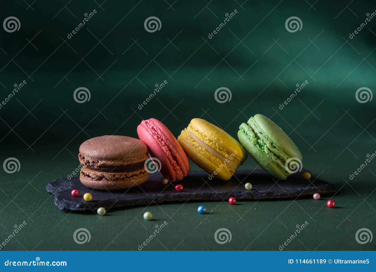 Assorted macarons on dish stock image. Image of sweet - 114661189