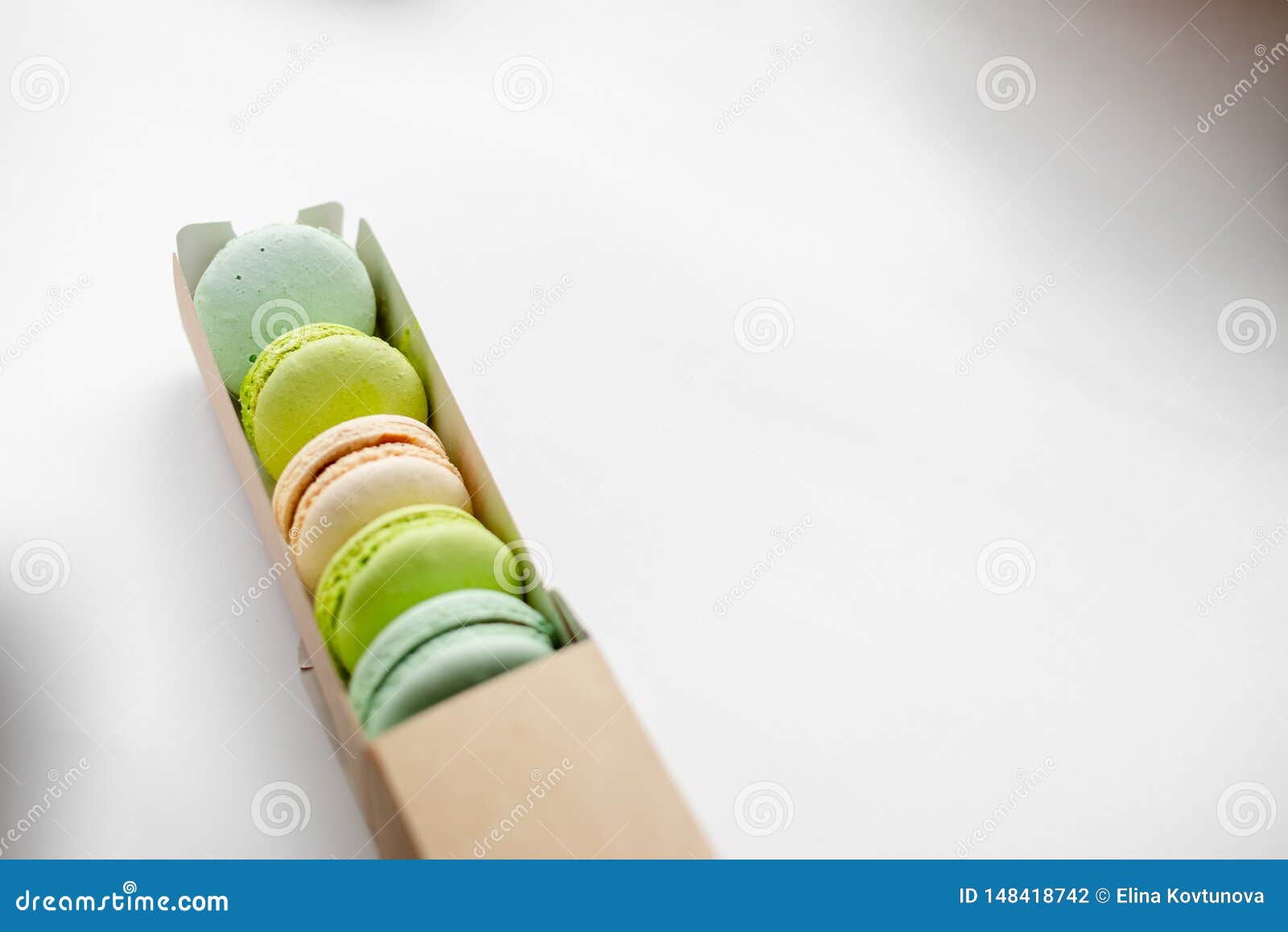 Assorted Macaroons in Craft Paper Box Flat Lay.white Table Background ...