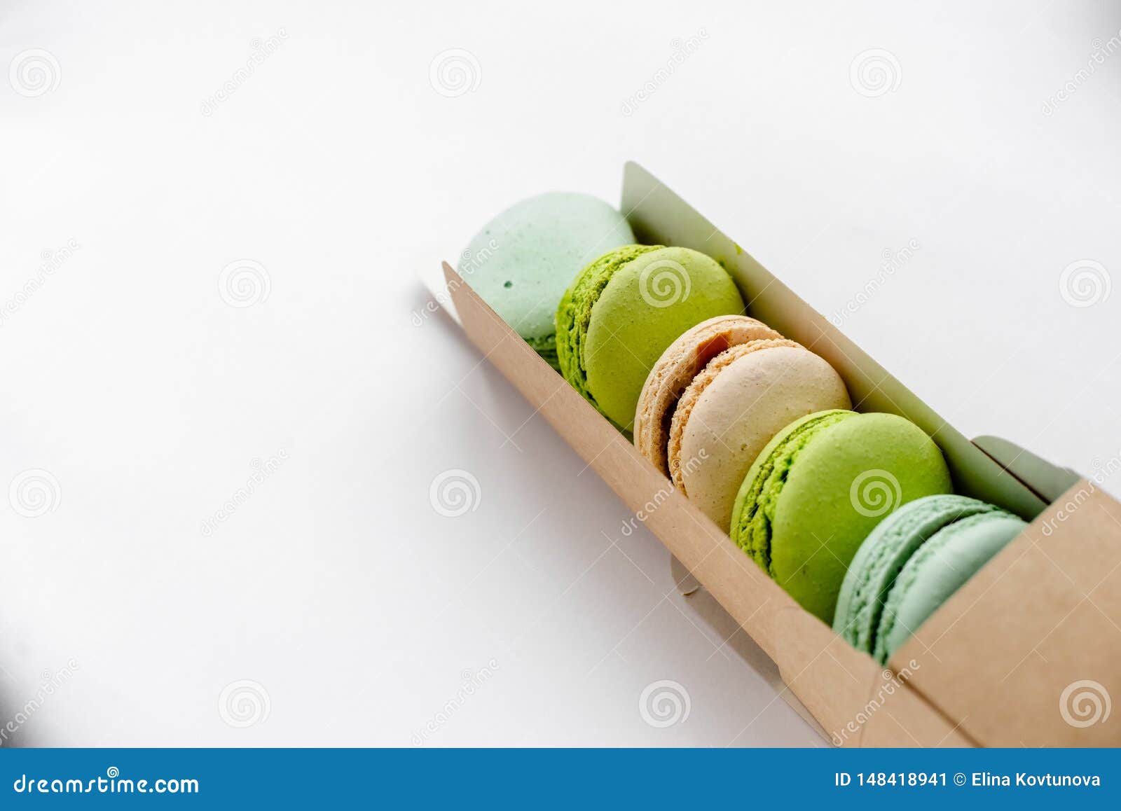 Assorted Macaroons in Craft Paper Box Flat Lay.white Table Background ...