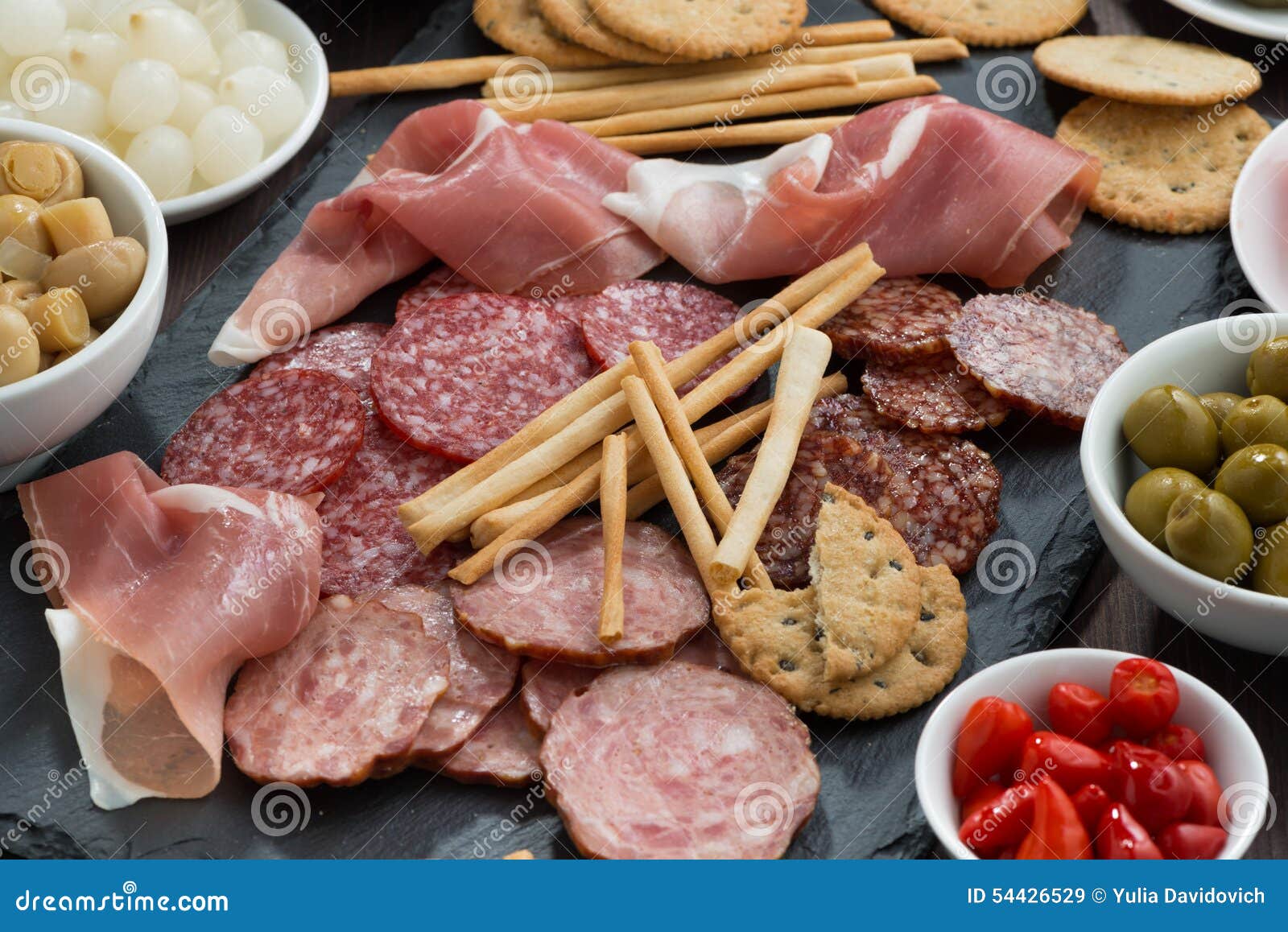Assorted Meat Snacks, Sausages and Pickles on a Blackboard Stock Image ...