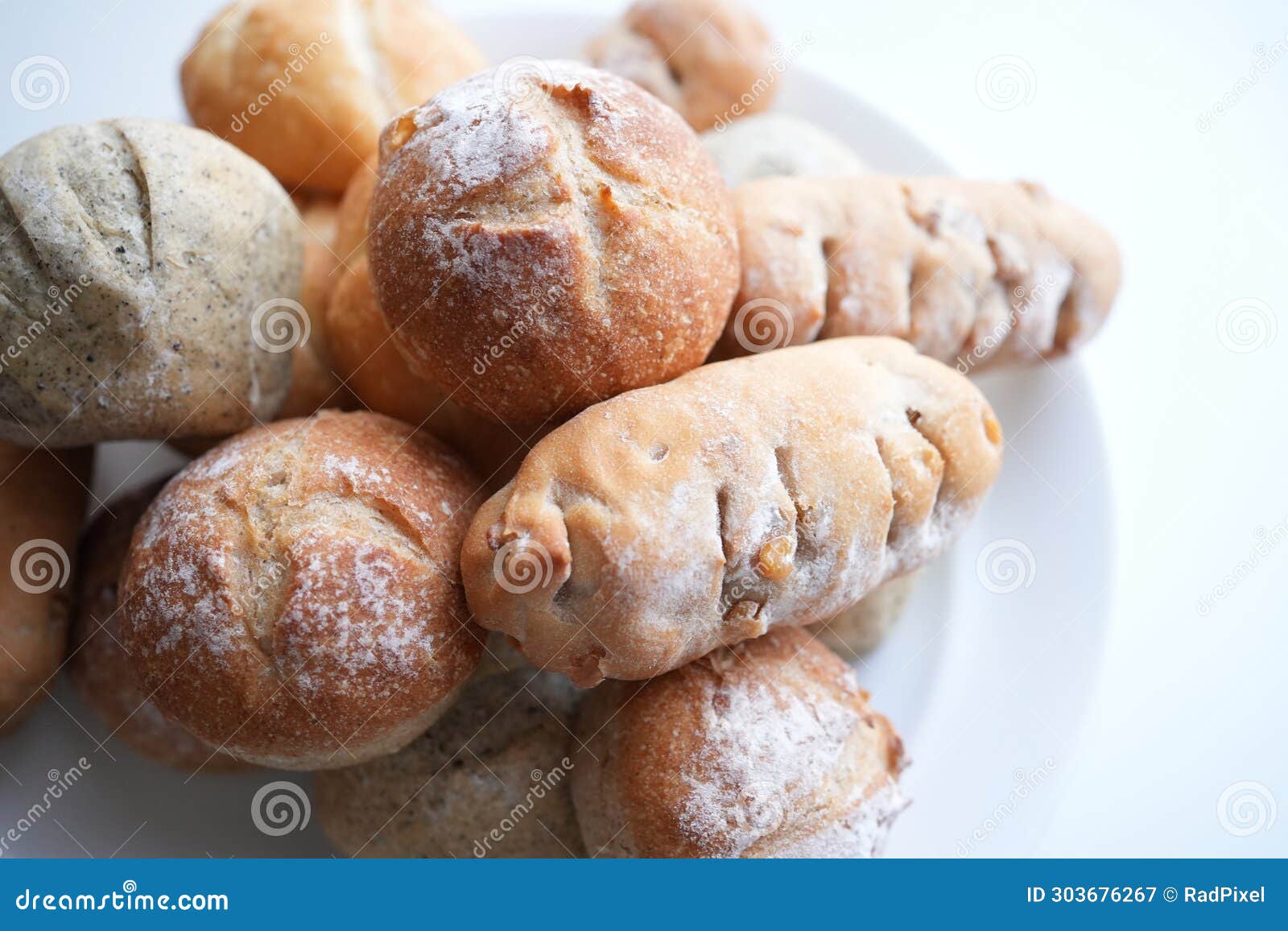 Assorted Miniature Bread Rolls on a White Plate Stock Image - Image of ...