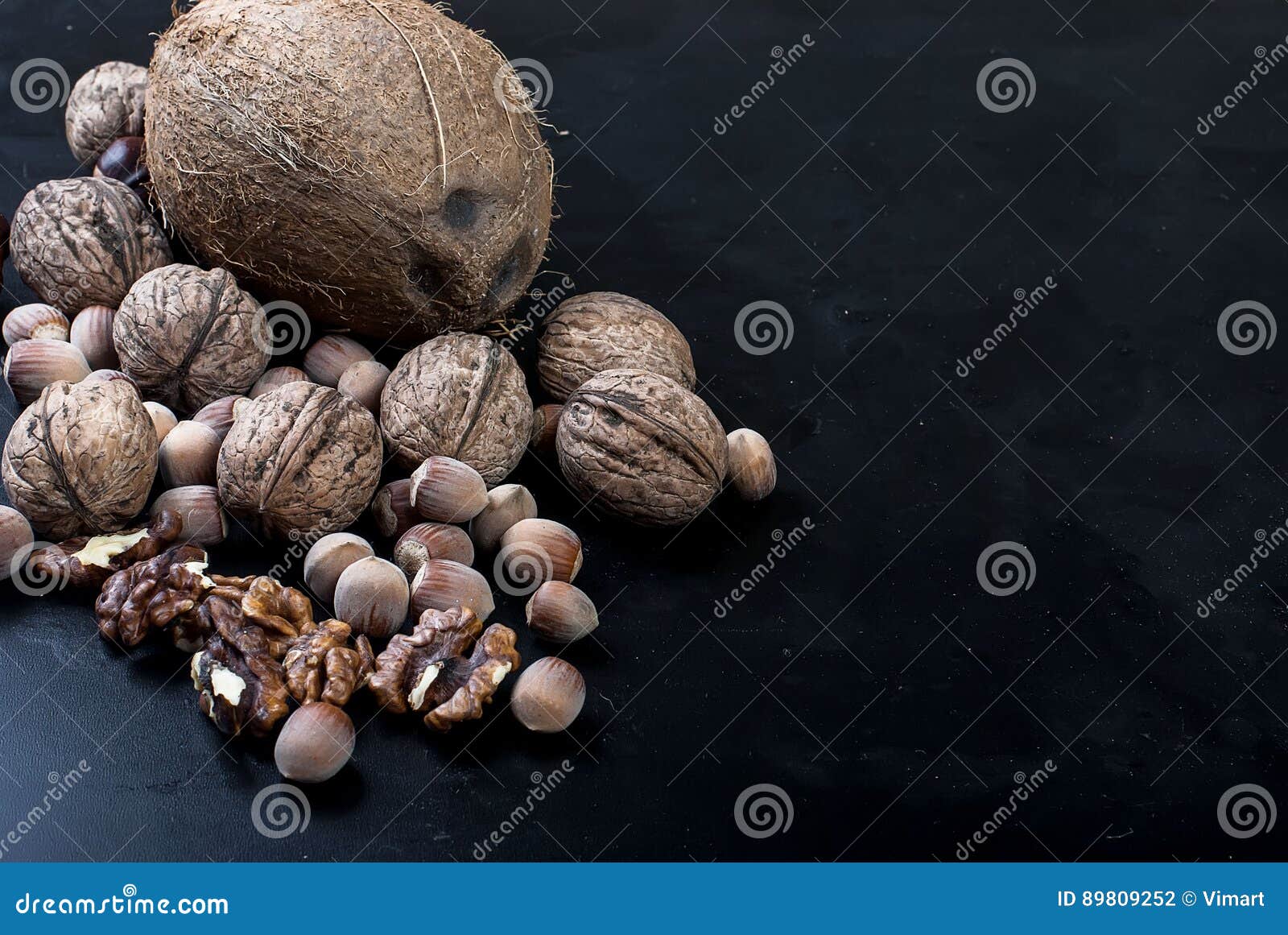 Assorted Nuts on a Black Background Stock Photo - Image of group, black ...
