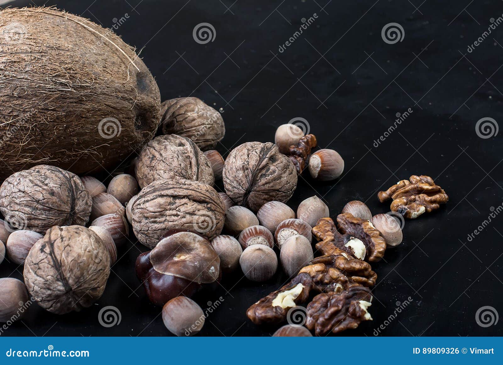Assorted Nuts on a Black Background Stock Photo - Image of shell, dried ...