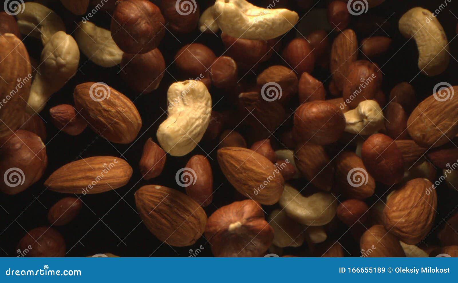 Assorted Nuts Flying in the Air in a Free Fall in Slow Motion on Black ...