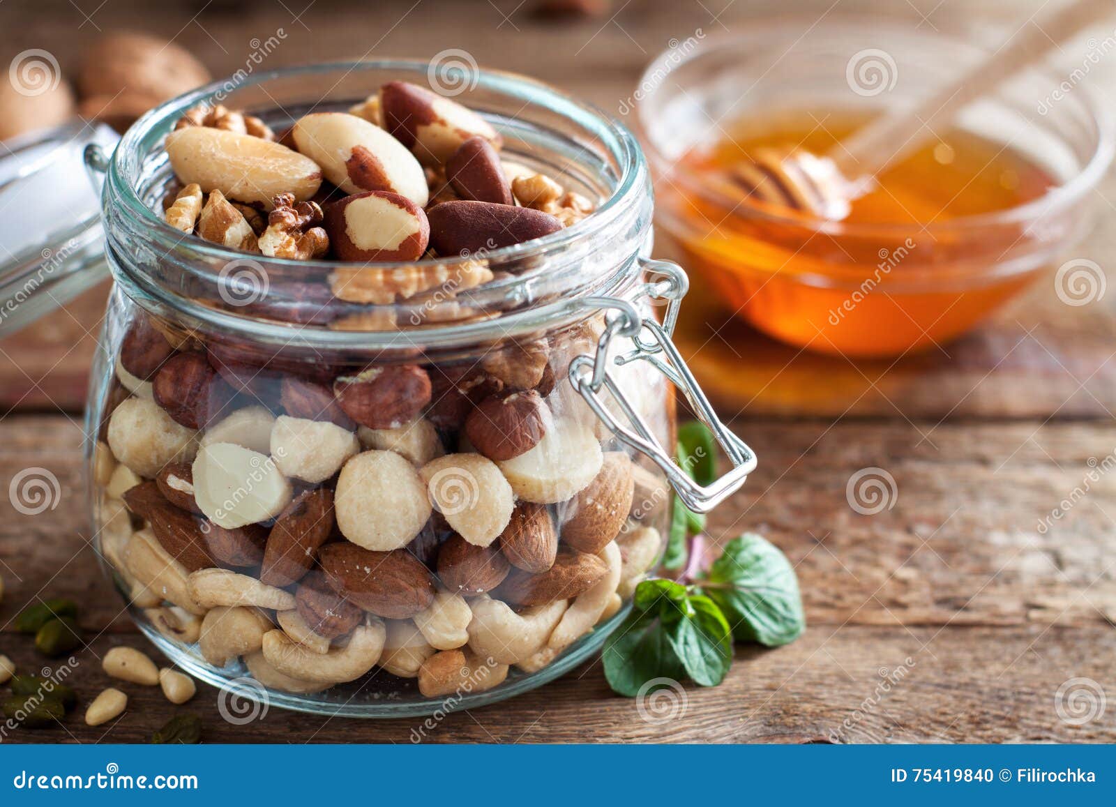 Assorted nuts in glass jar stock photo. Image of honey - 75419840