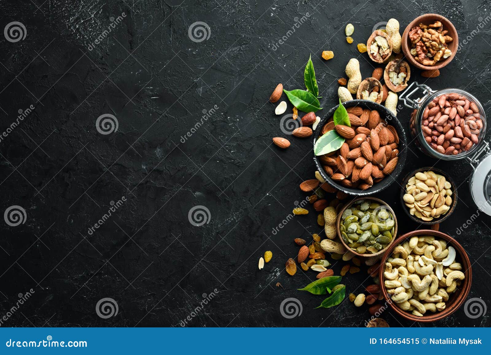 Assorted Nuts on the Old Black Background. Stock Image - Image of ...