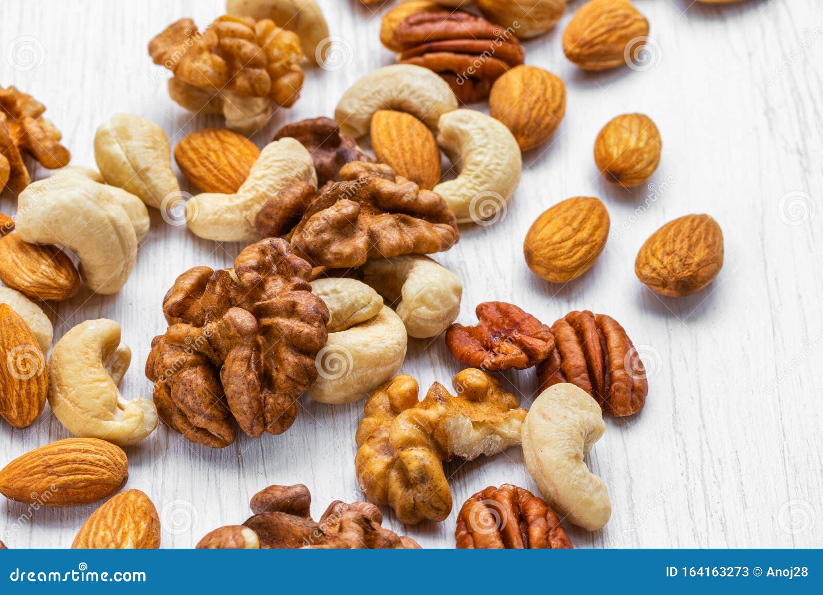 Assorted Nuts Scattered on a White Wooden Surface Stock Image - Image ...