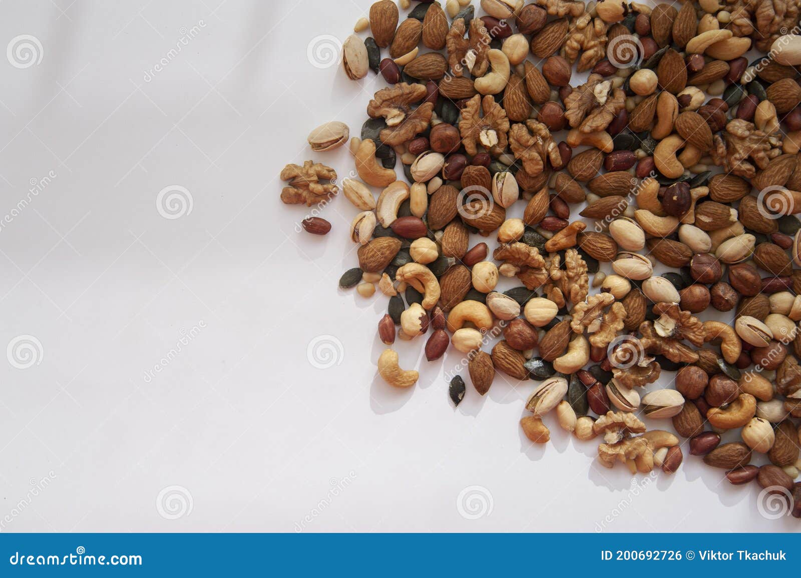 Assorted Nuts on a White Background Stock Photo - Image of handful ...