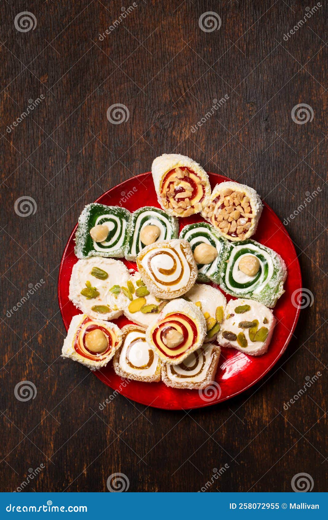 Assorted Oriental Sweets Turkish Delight with Nuts on a Red Plate Stock ...