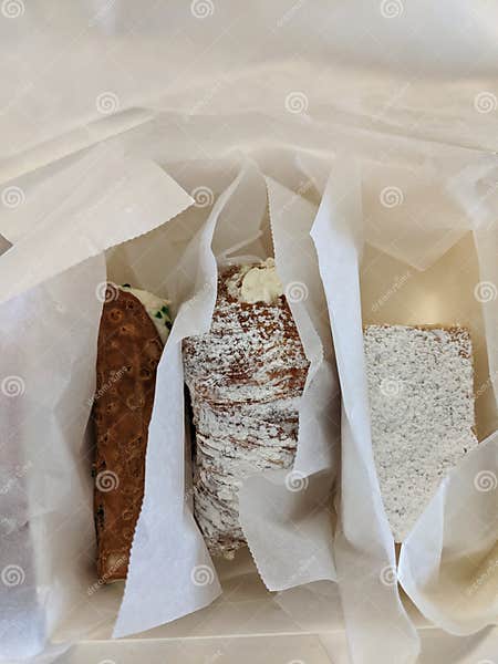 Assorted Pastries Separated by Paper in a Box Stock Photo - Image of ...