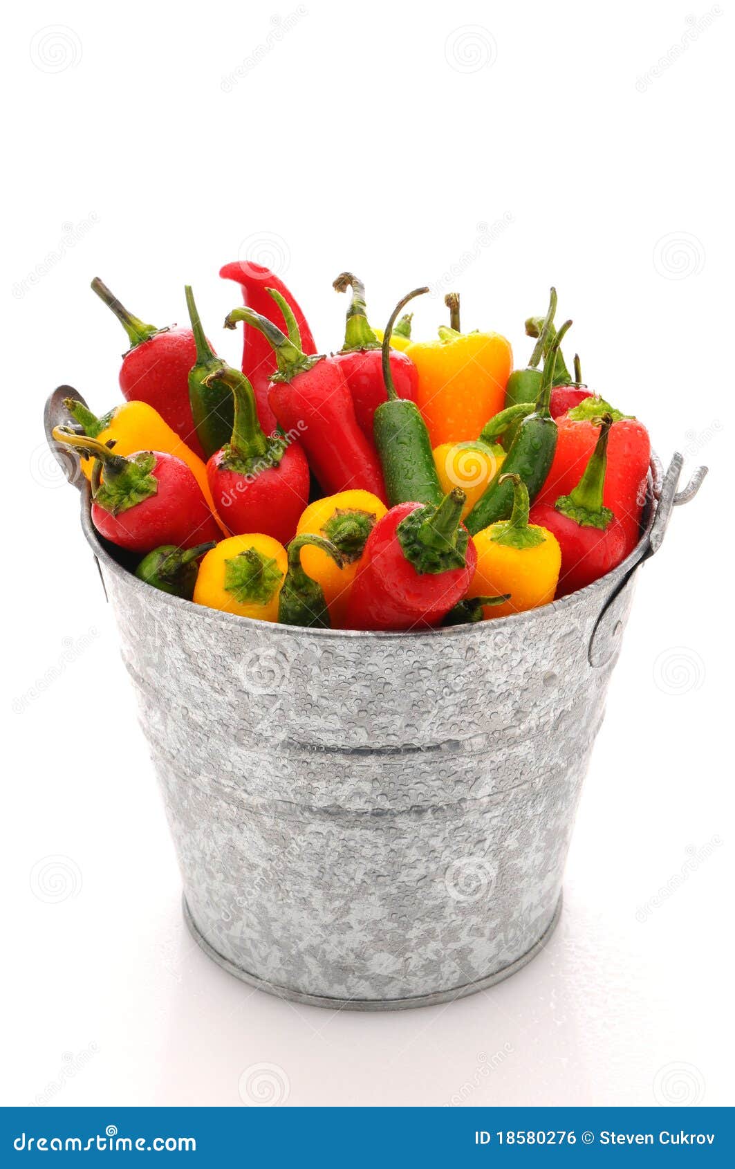 Assorted peppers in pail stock photo. Image of white - 18580276