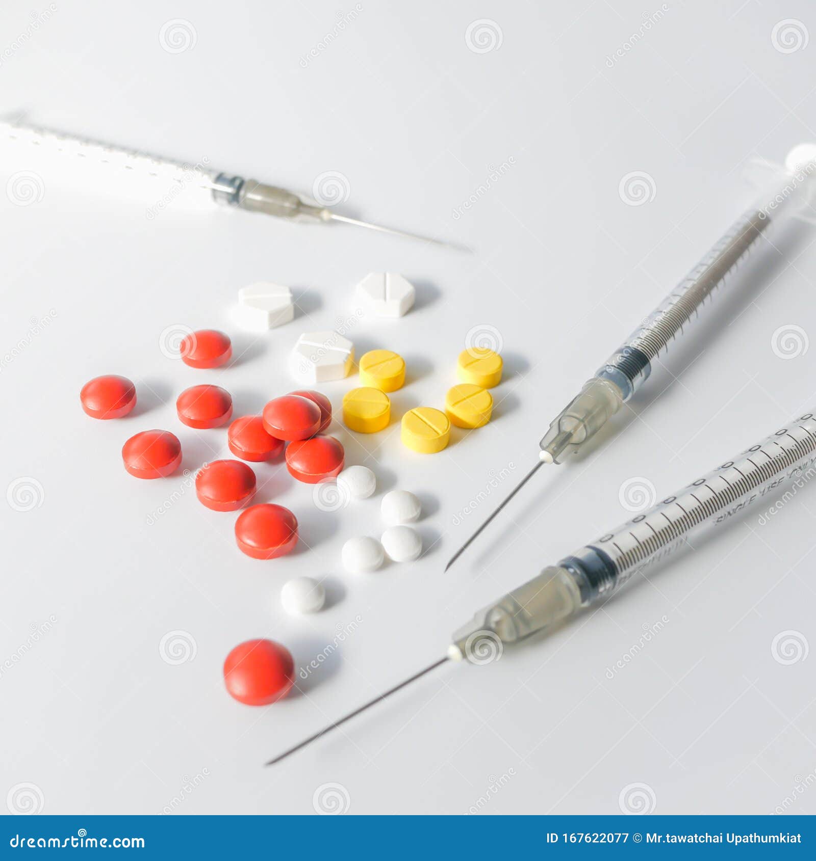 Tablets And A Syringe On A White Background. A Syringe For Injection ...