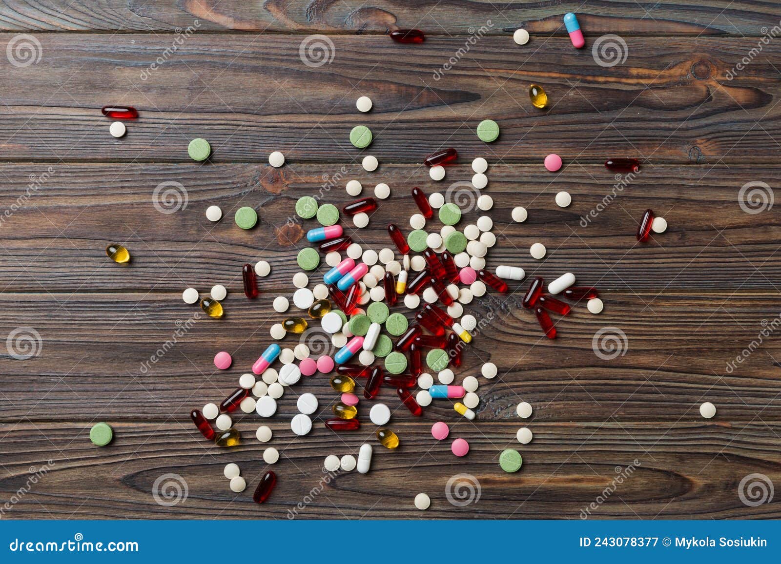Assorted Pills and Tablets Top Border Over Colored Background. Many ...