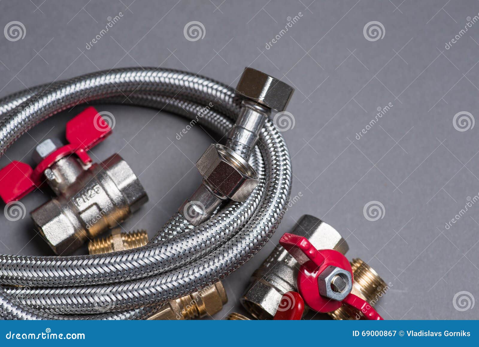 Assorted Plumbing Fittings and Hose on Grey Stock Image - Image of ...
