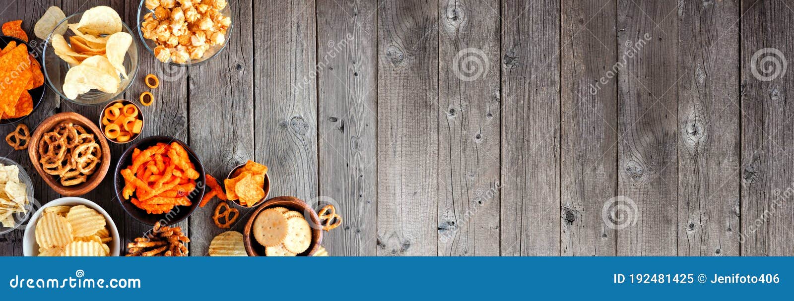 Assorted Salty Snacks, Top Down Side Border On A Grey Stone Background ...