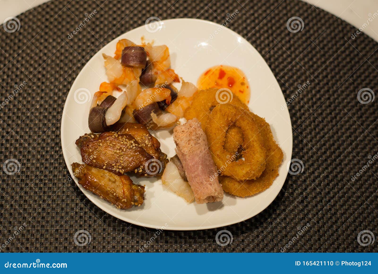 Assorted Savoury and Sweet Fried Pre-dinner Canapes and Sushi on a ...