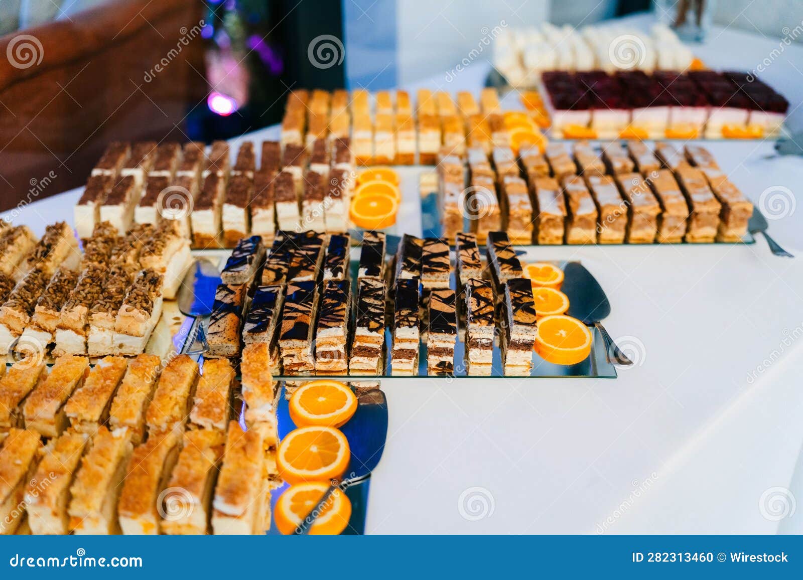 Assorted Selection of Cake Pieces, and Desserts in Trays Stock Photo ...