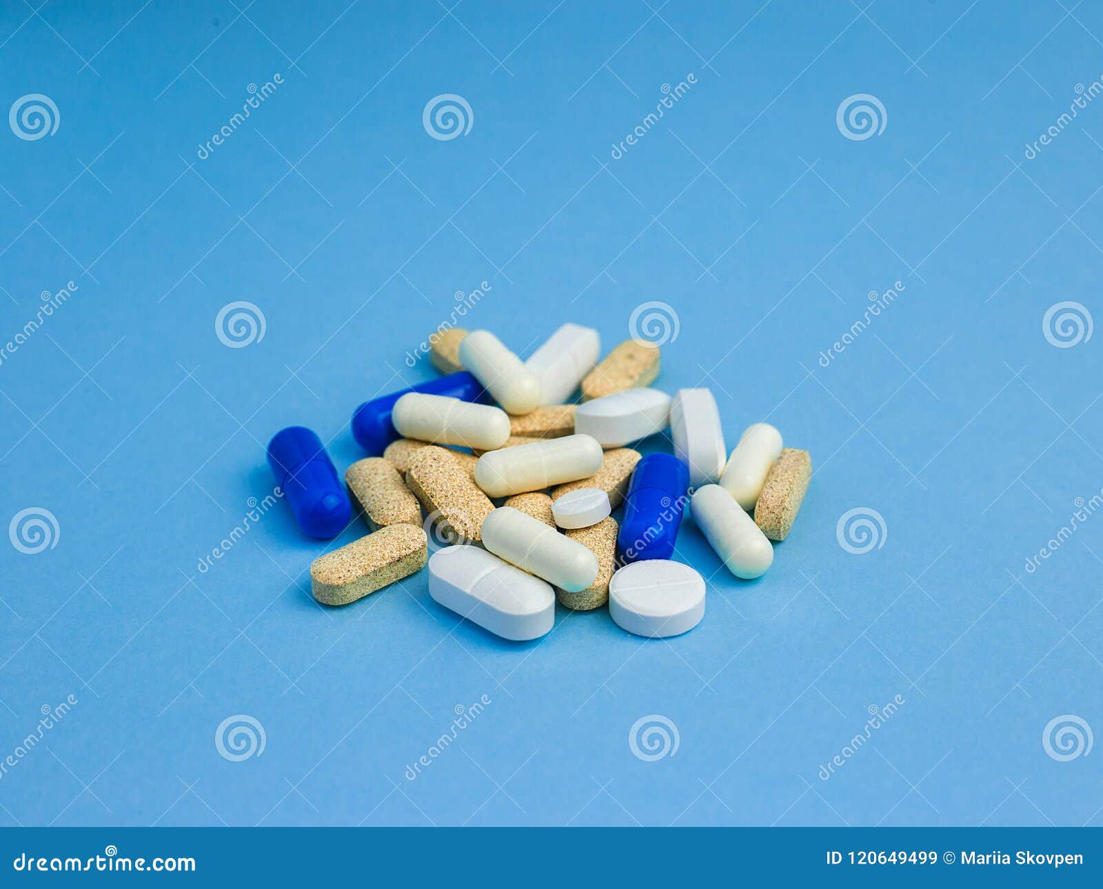 Assorted Size and Shape Different Pills on a Blue Background Stock ...