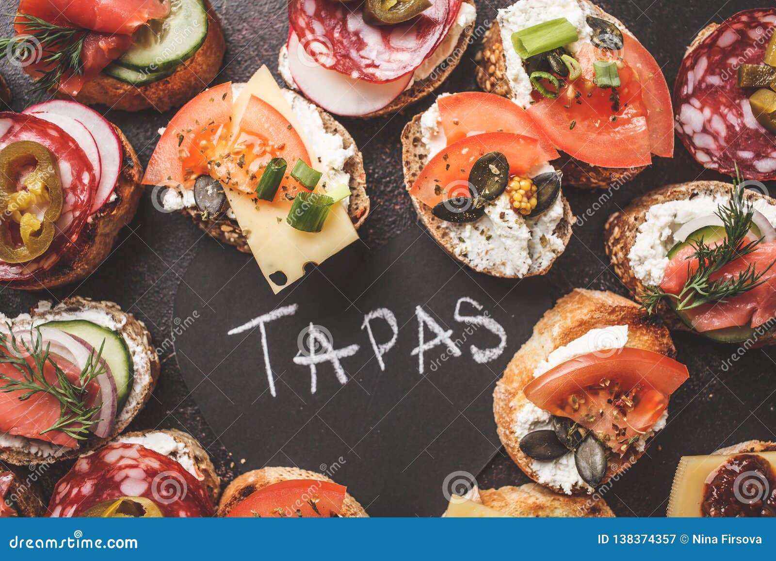 Assorted Spanish Tapas With Fish, Sausage, Cheese And Vegetables. Dark ...