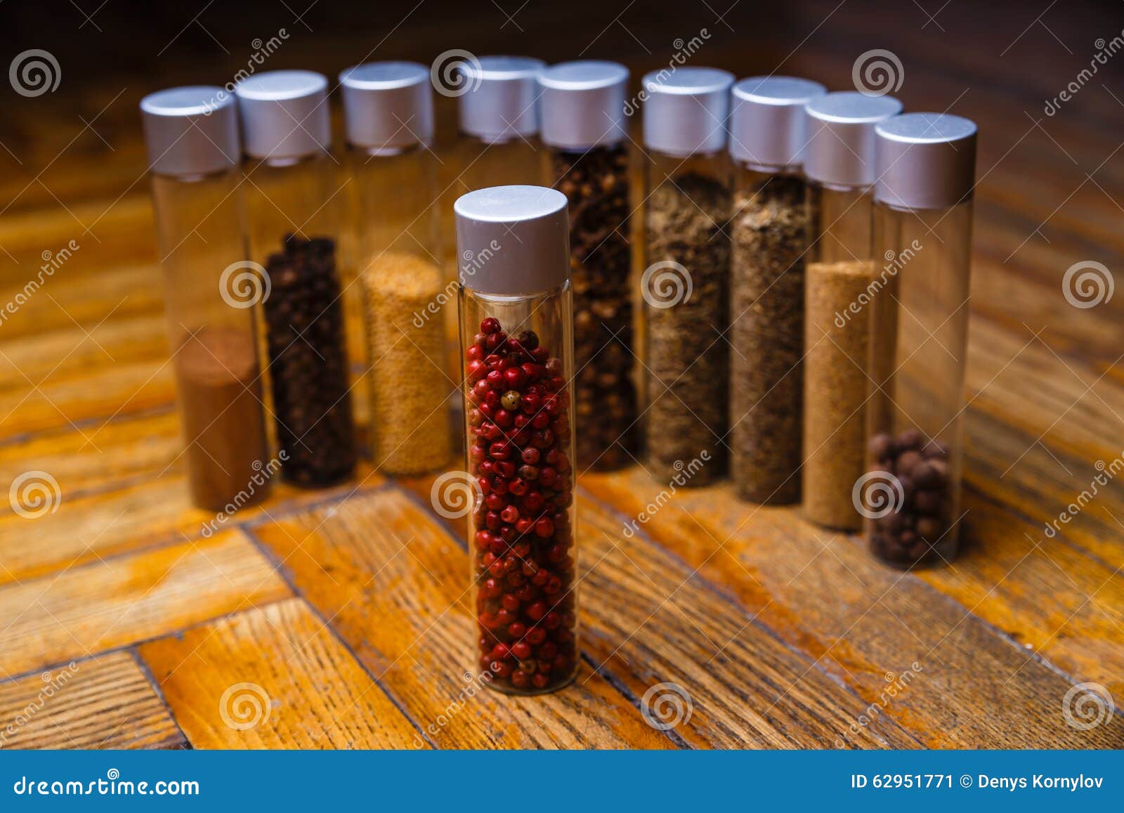 Assorted Spices in Bottles on Wooden Background Stock Image - Image of ...