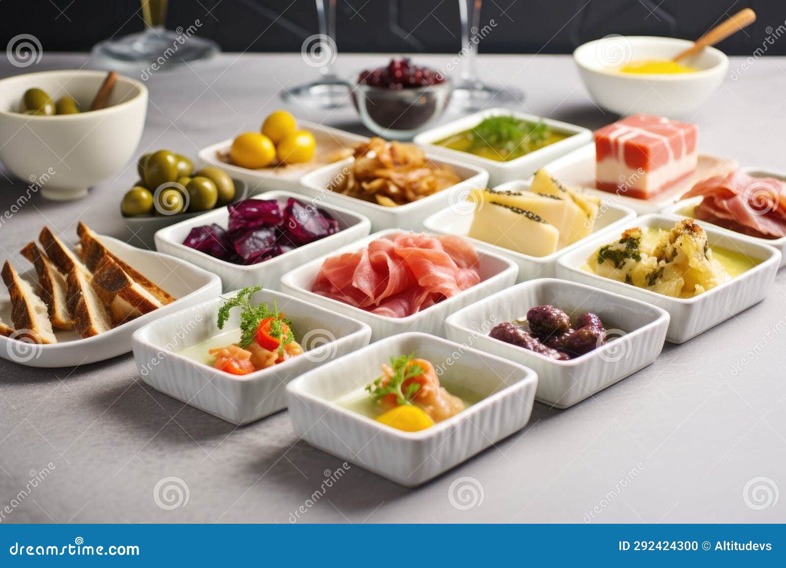 Assorted Tapas in White Ceramic Dishes Against a Stone Backdrop Stock ...