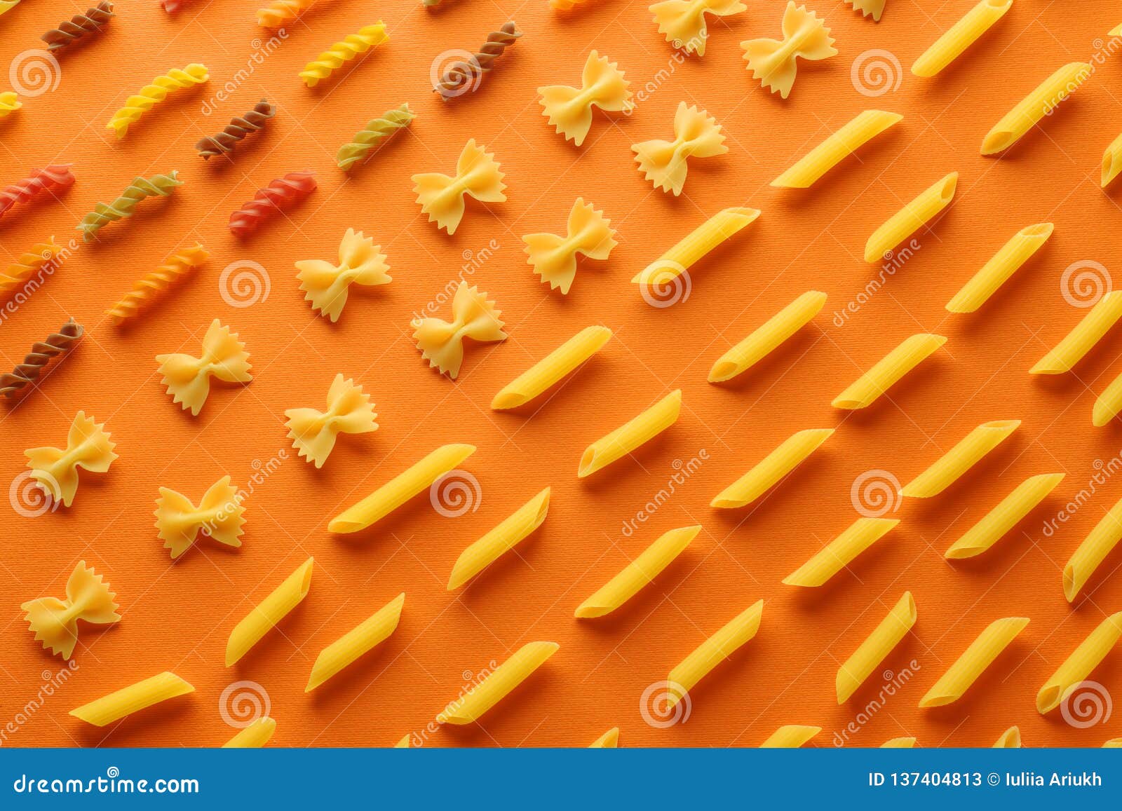 Assorted Types of Pasta Organized on Orange Background. Flat Lay ...