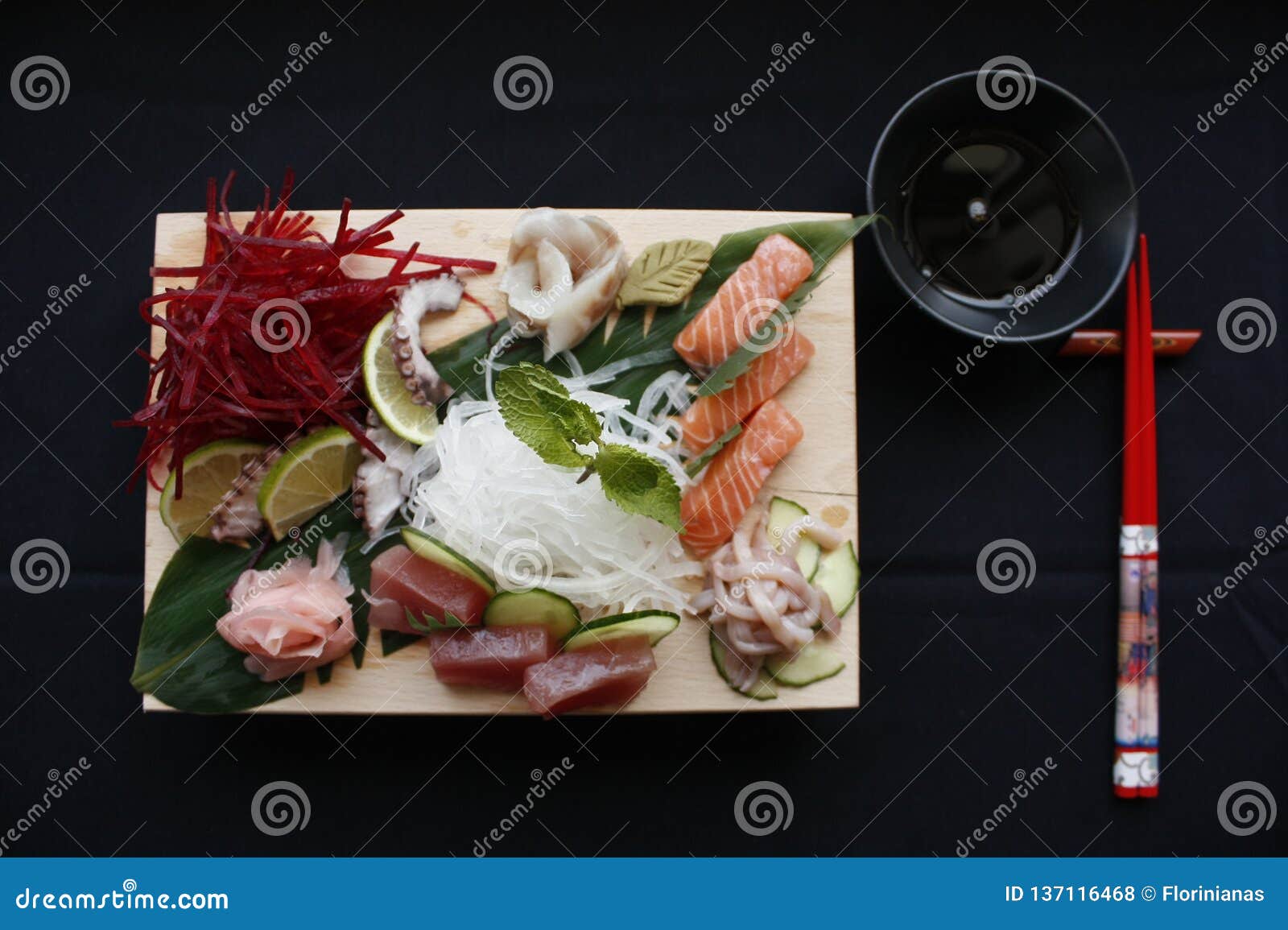 Assorted Types of Sushi on Bamboo Table with Hashi Chopsticks and Shoyu ...