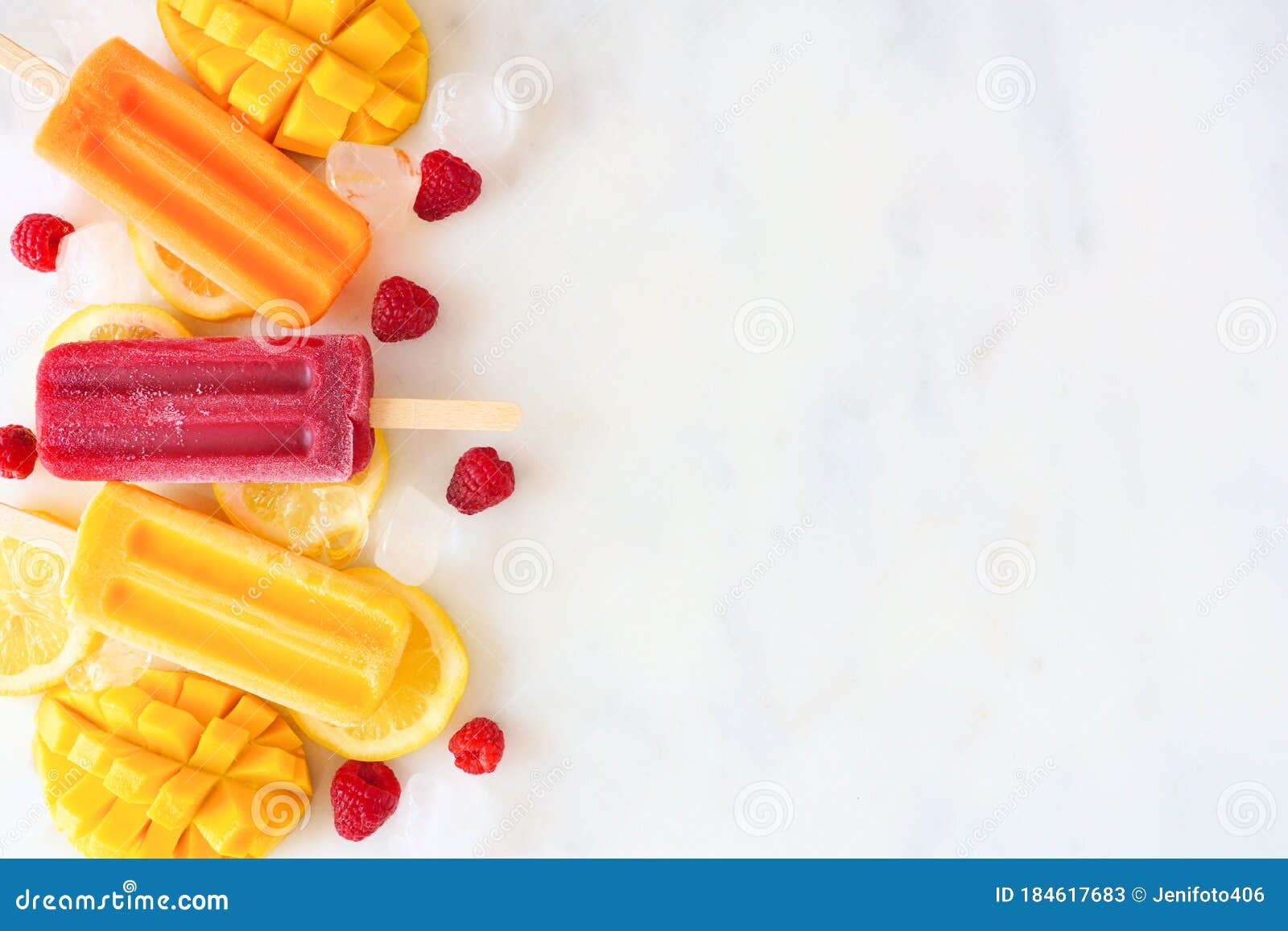 Vibrant Summer Fruit Popsicle Side Border, Top View on a White Marble ...