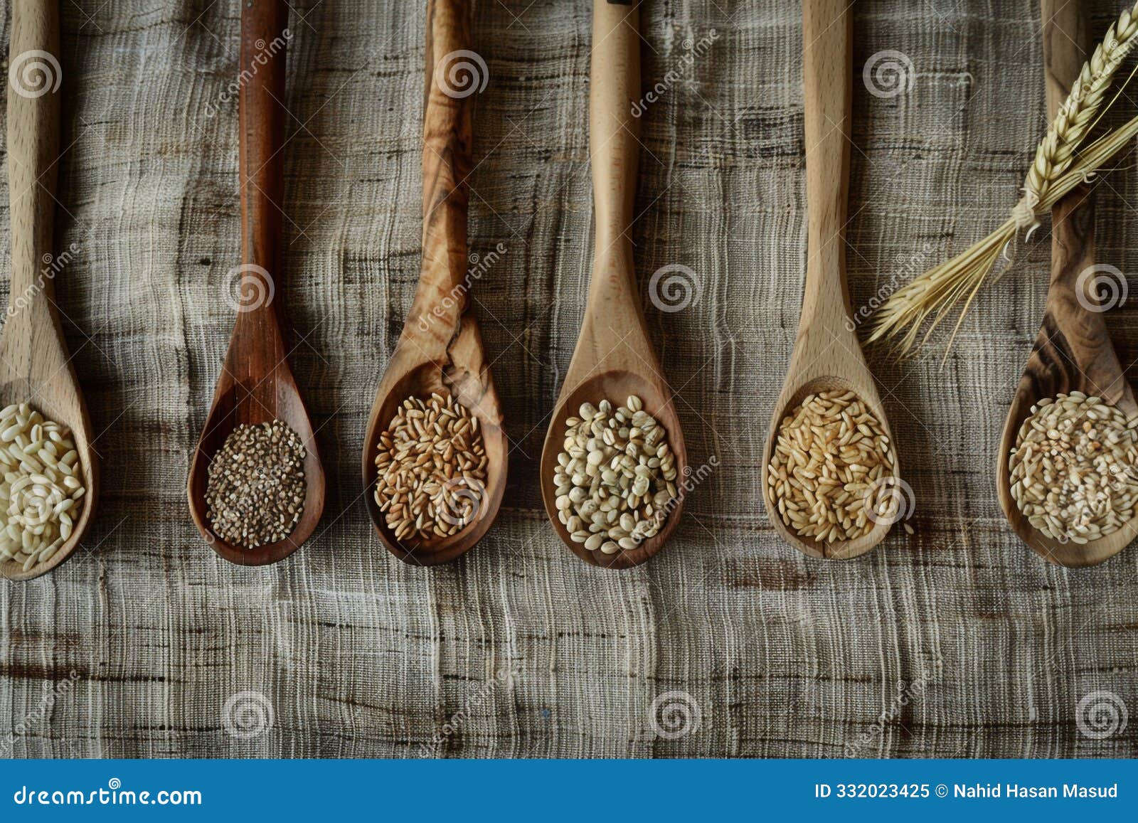Assorted Whole Grains in Rustic Wooden Spoons on Textured Table Stock ...