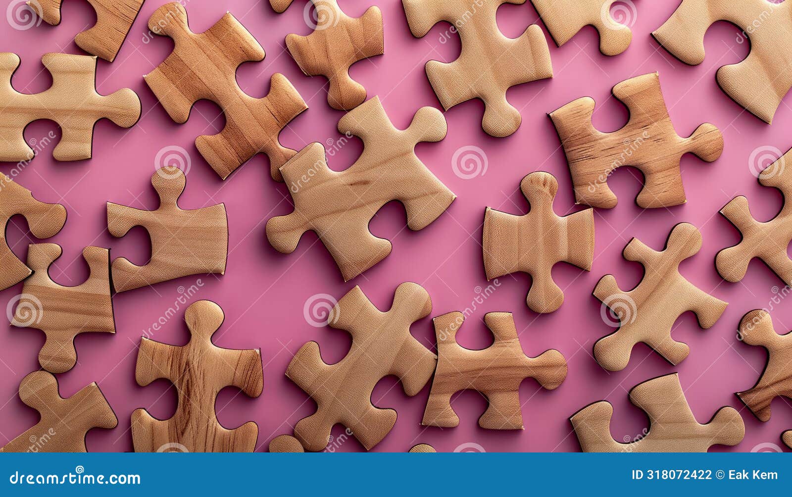 Assorted Wooden Puzzle Pieces Scattered on a Vibrant Pink Background ...