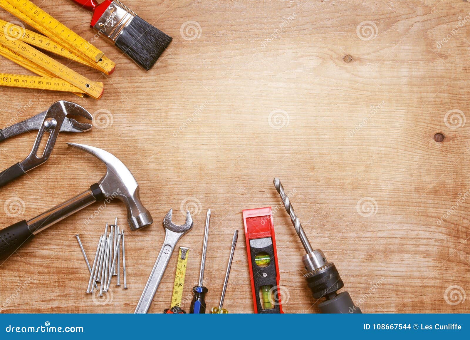 Tools on wooden background stock photo. Image of floor - 108667544