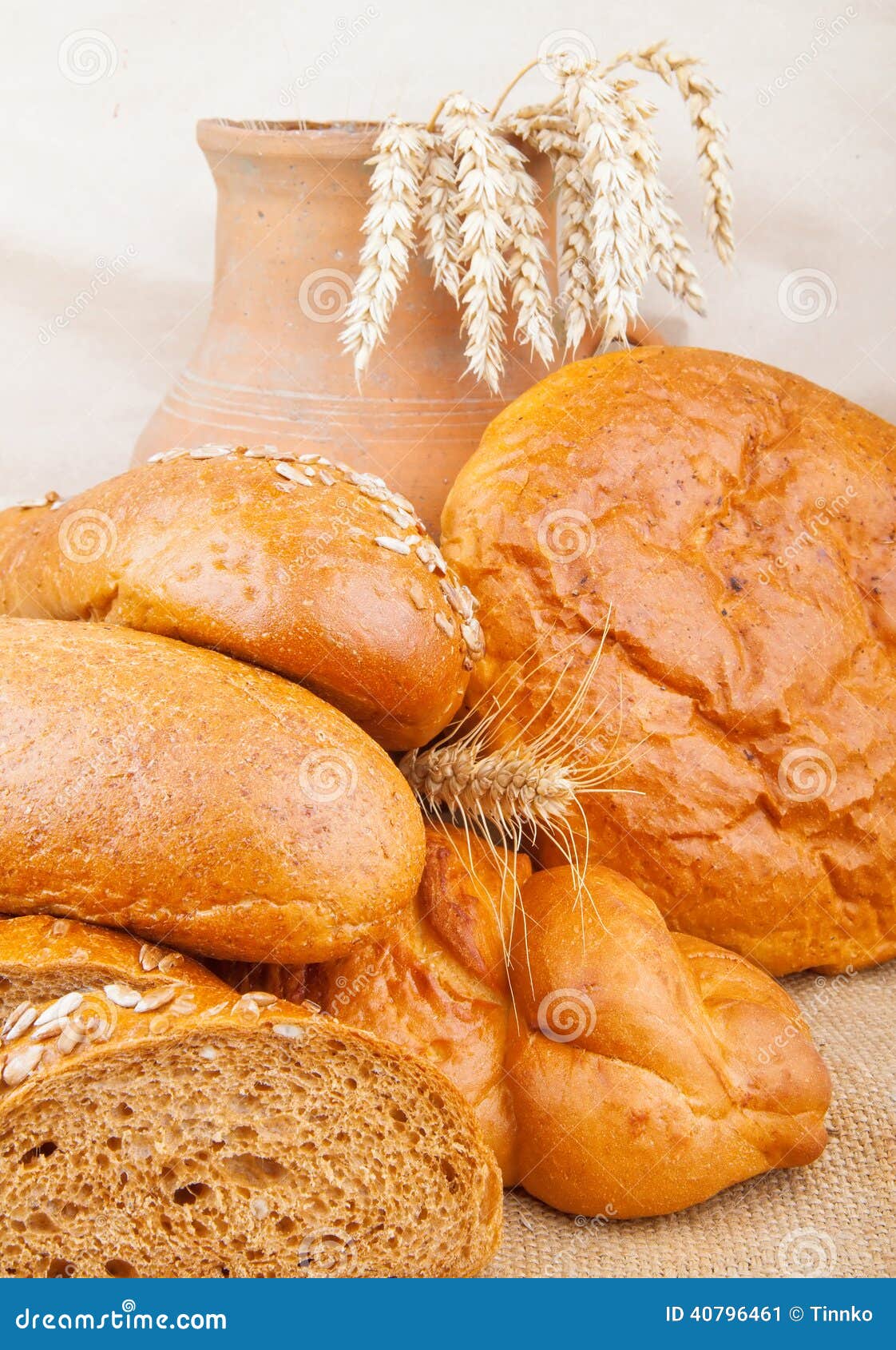 Assortment of Baked Breads and Pitcher Stock Image - Image of seed ...