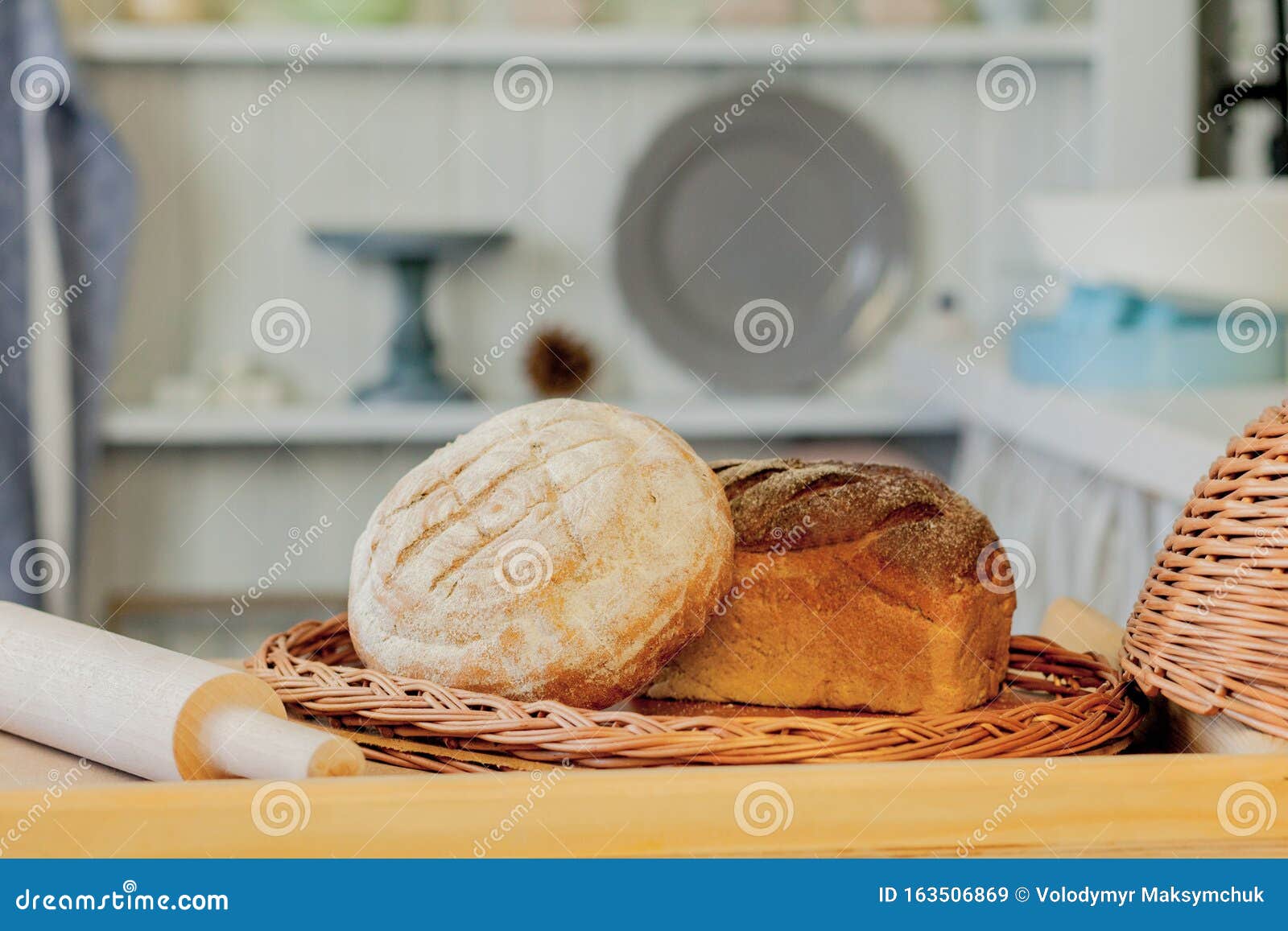 Assortment of Breads Near a Wicker Basket on a Table in a Rustic ...