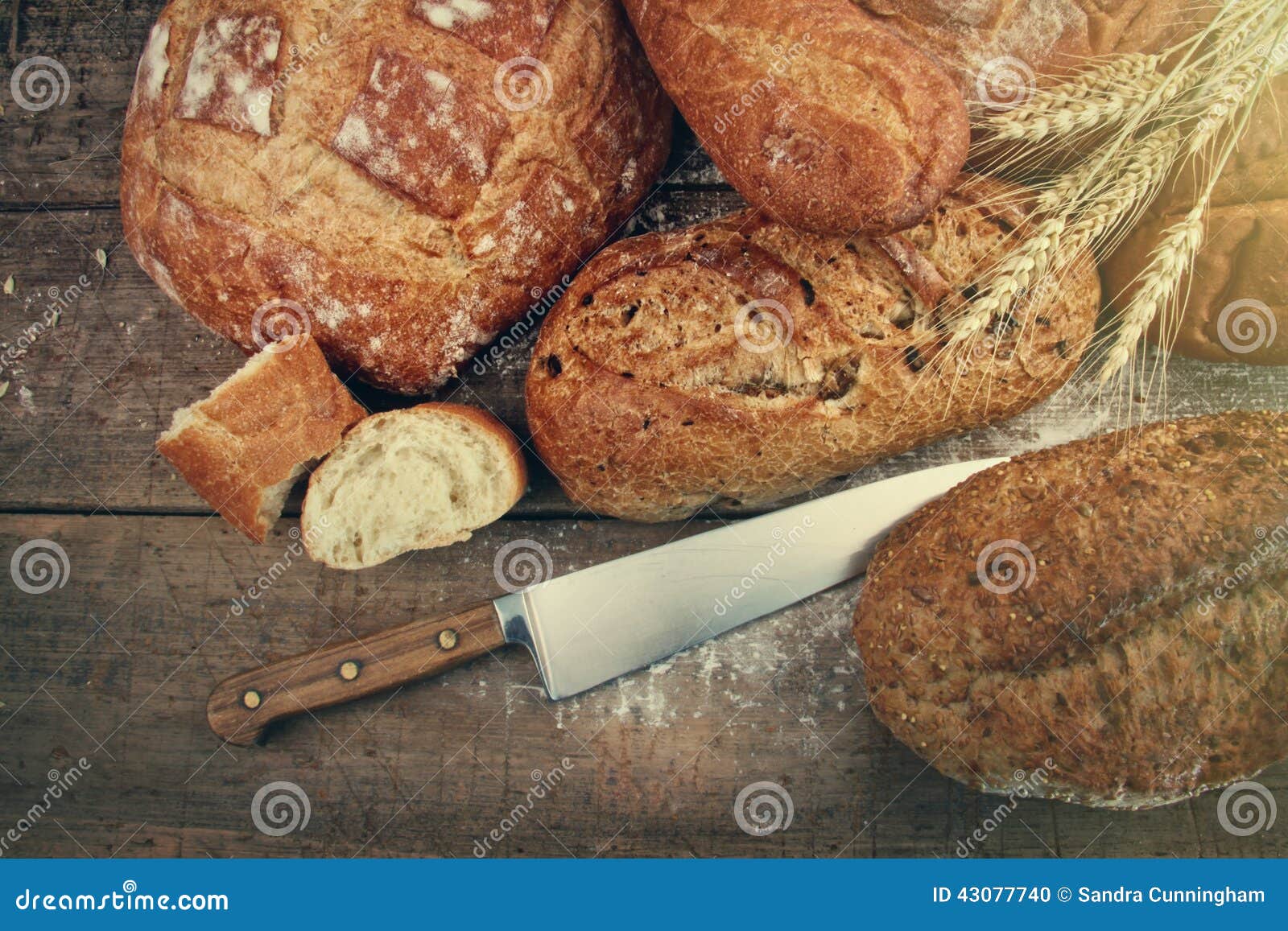 Assortment of Breads on Wood Stock Photo - Image of nutrition, grain ...