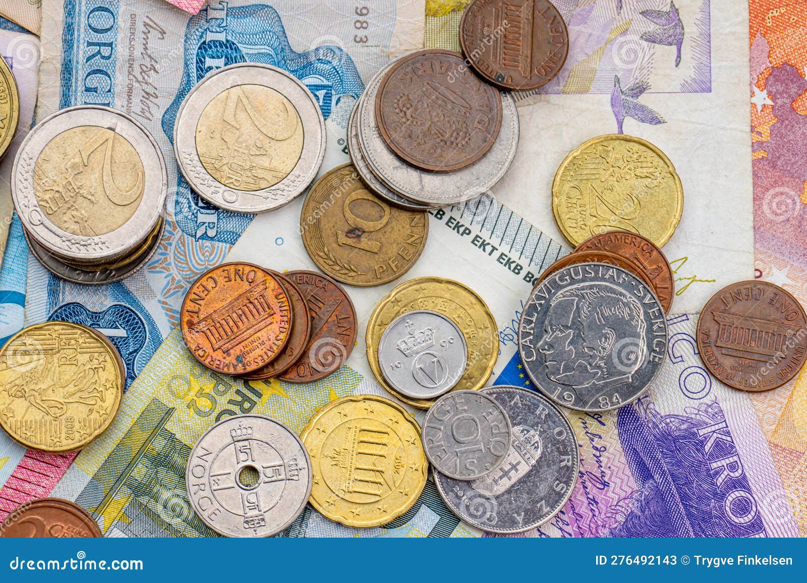 Assortment of Coins on Bank Notes from Different Countries.. Stock ...