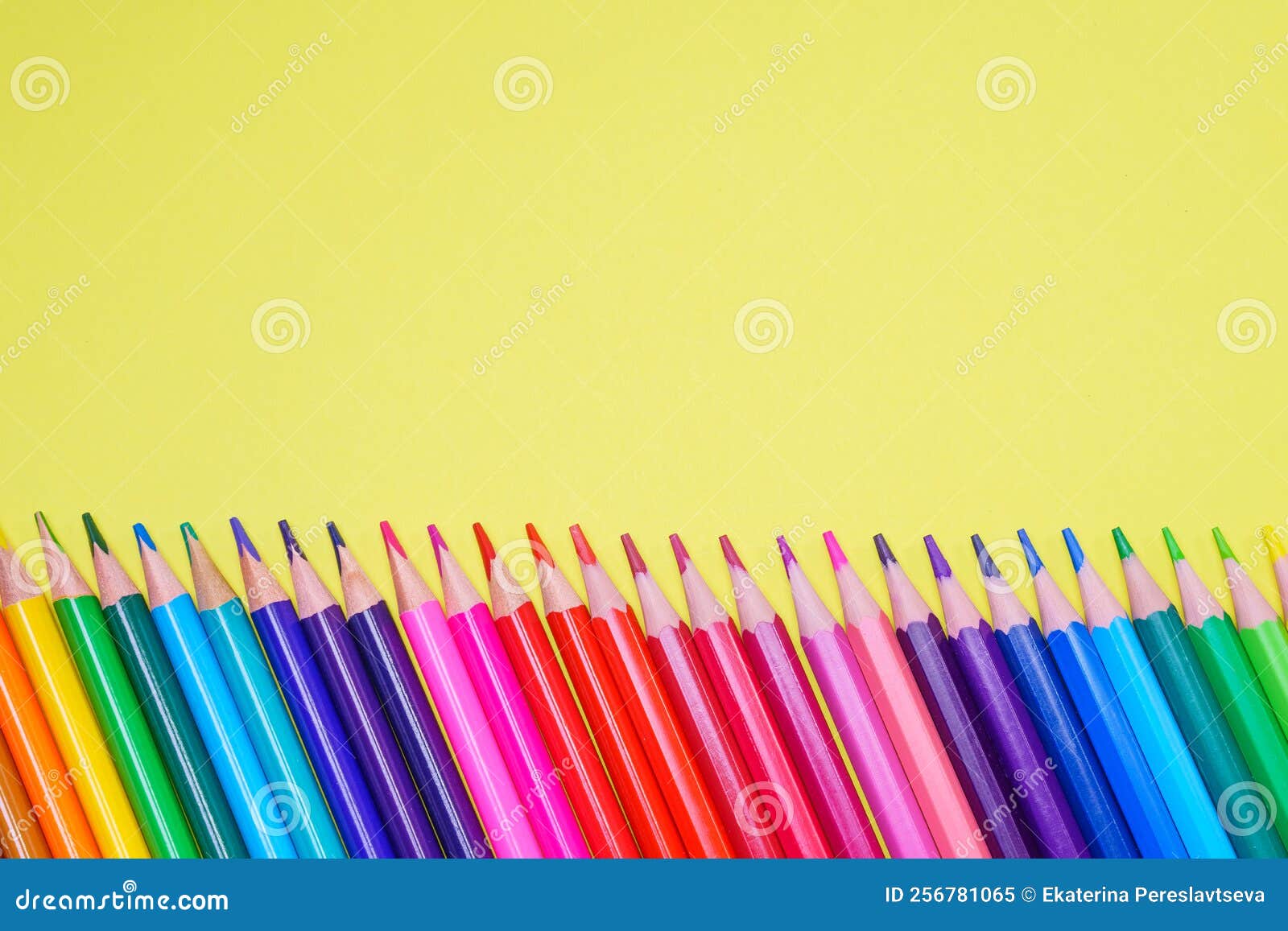 Assortment of Colored Pencils in Various Iridescent Colors on a Yellow ...