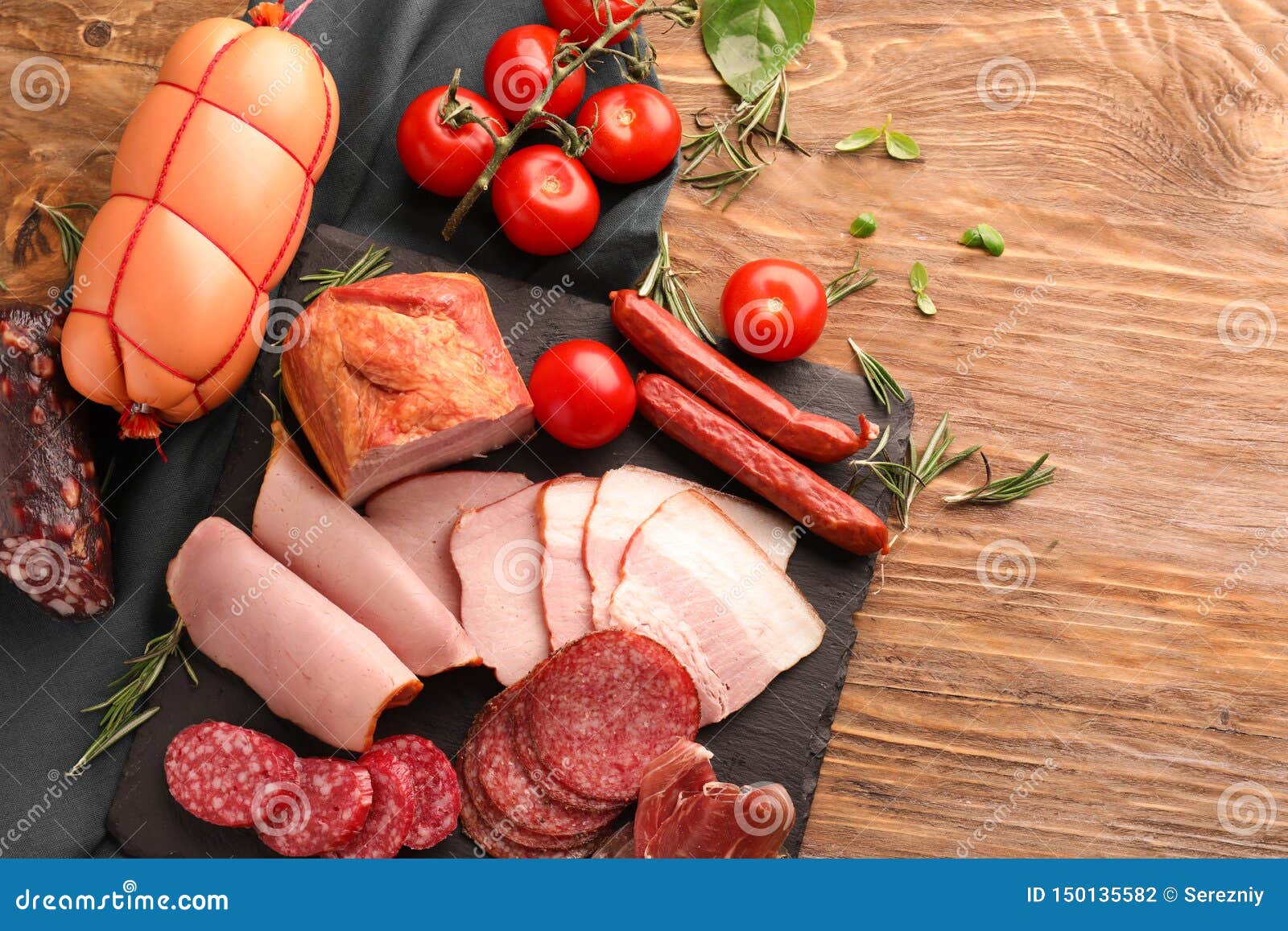 Assortment of Delicious Deli Meats on Slate Plate Stock Photo - Image ...
