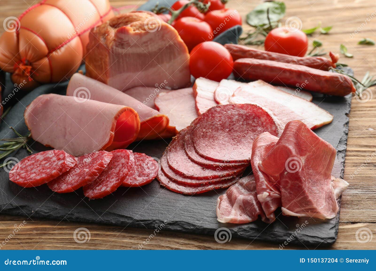 Assortment of Delicious Deli Meats on Slate Plate Stock Photo - Image ...