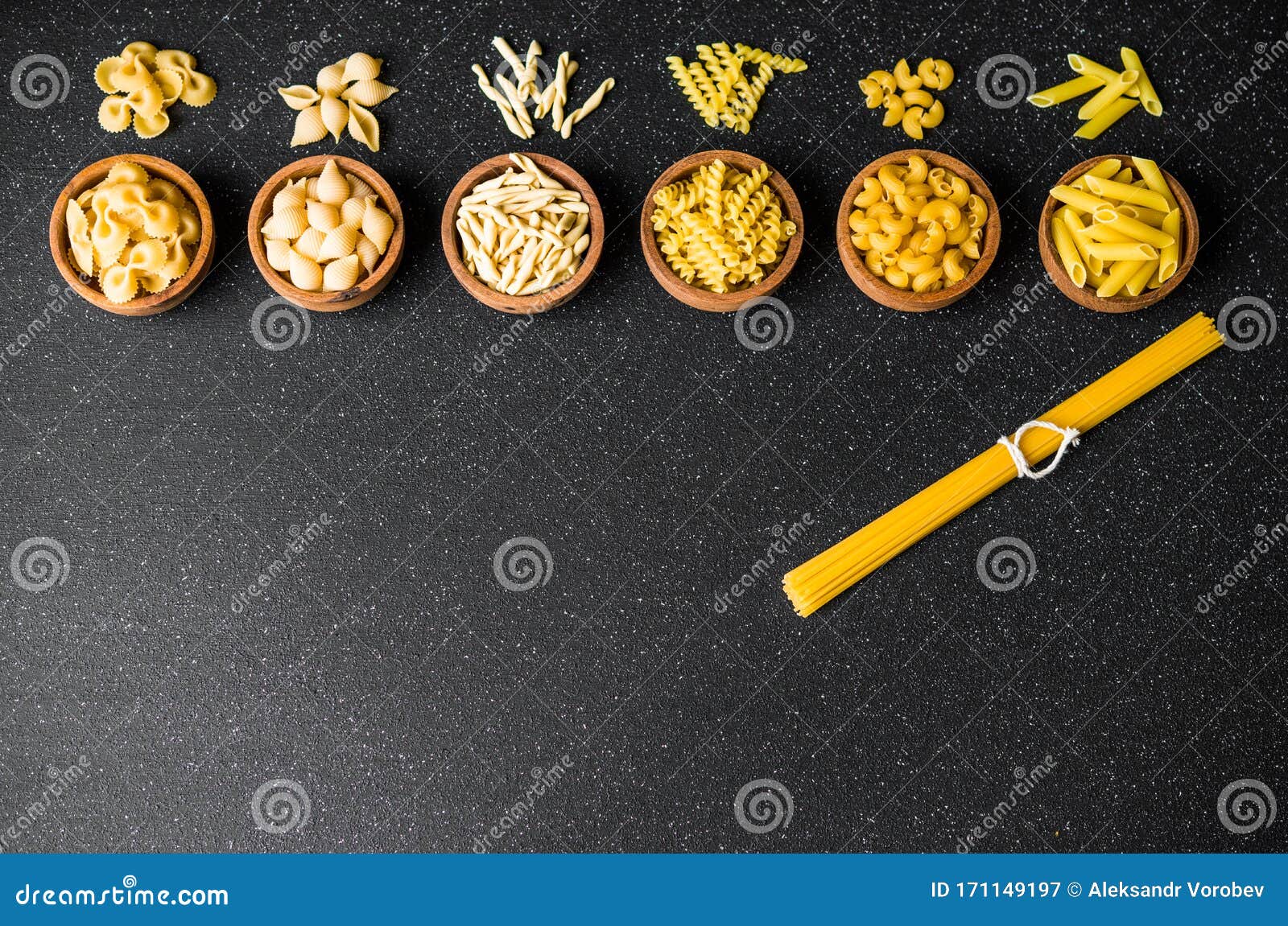 Assortment of Different Dry Pasta Types Against Black Background, Top ...