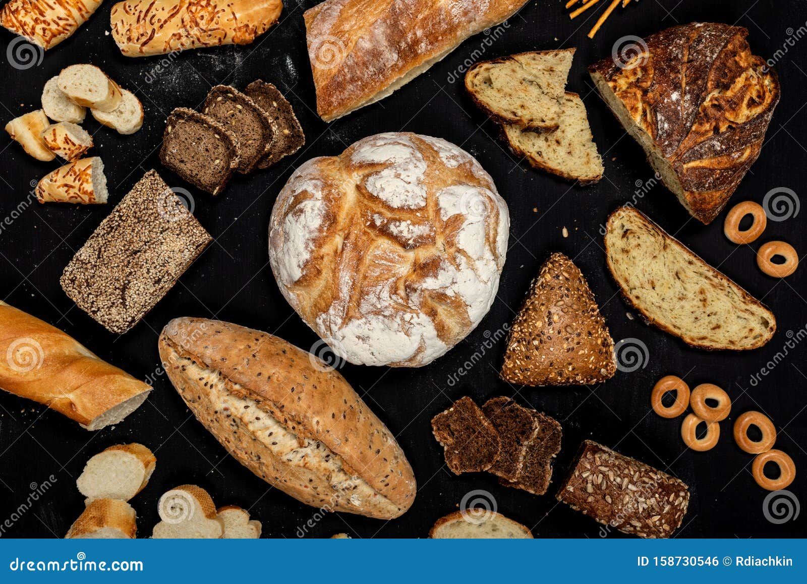 Assortment of Different Types of Bread on a Black Background. Top View ...