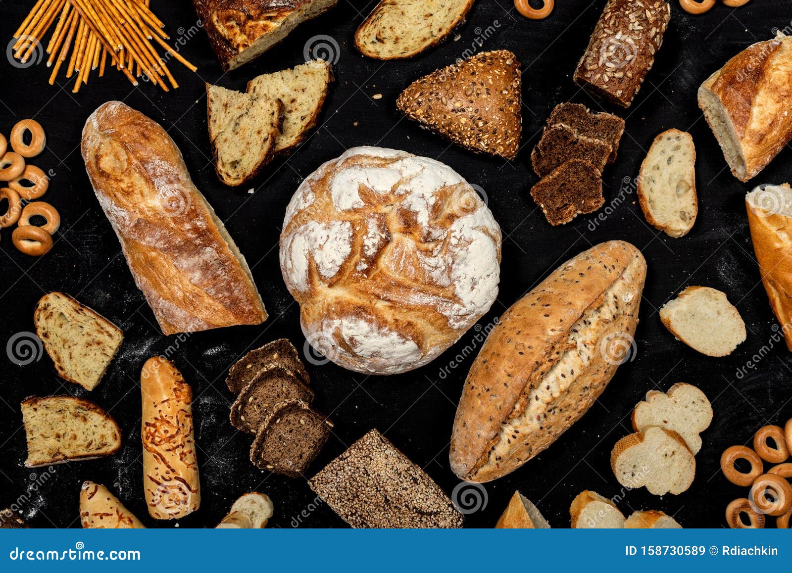 Assortment of Different Types of Bread on a Black Background. Top View ...
