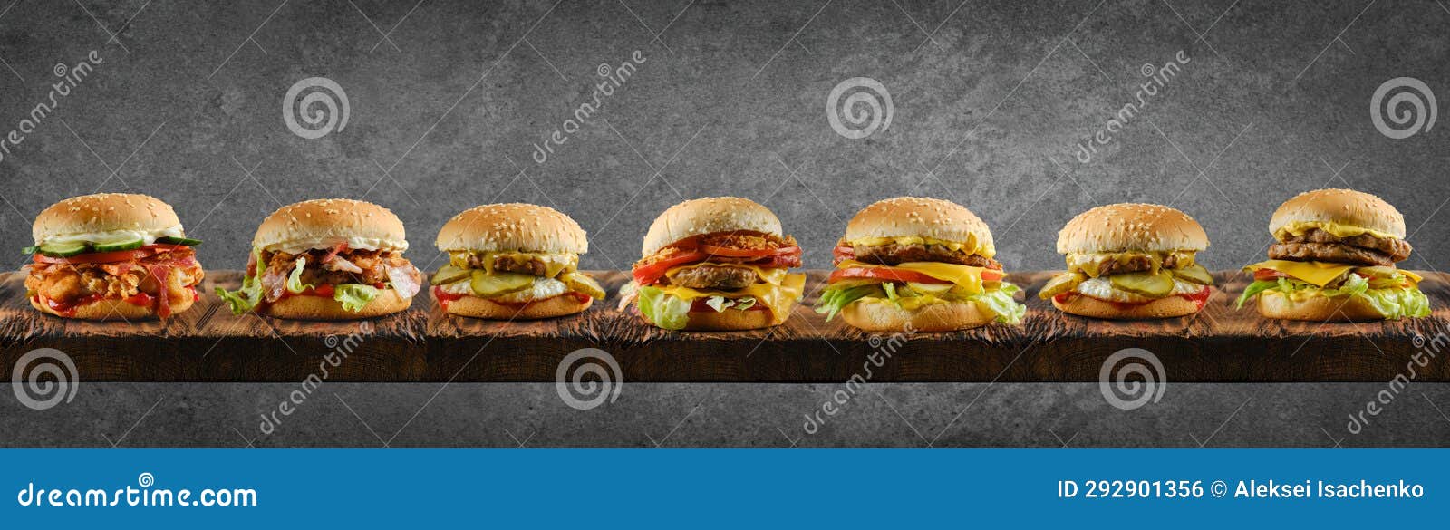 Assortment of Different Types of Burgers on Wooden Board Stock Photo ...